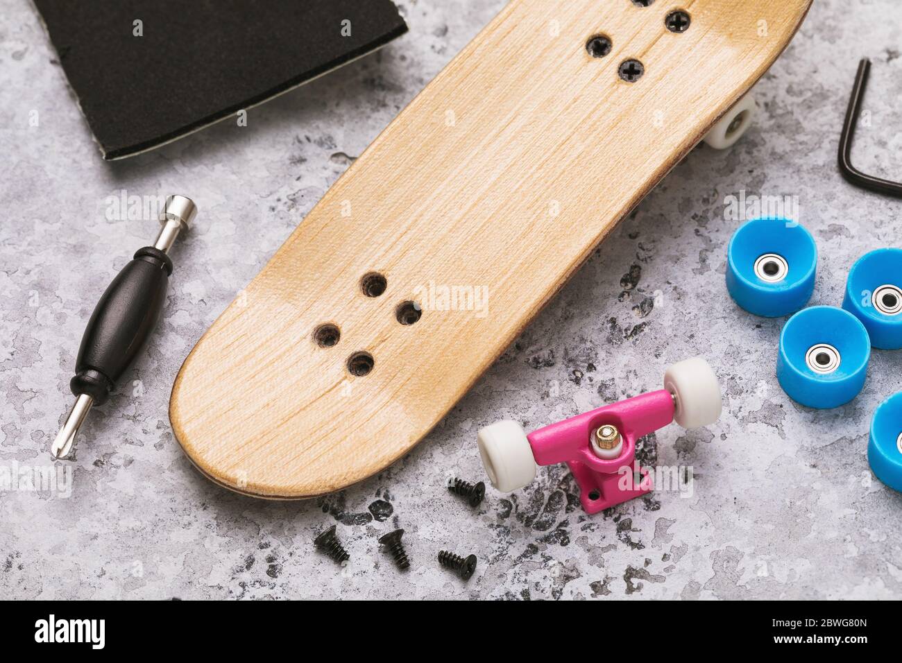 Fingerboard, chassis and wheels with repair tools Stock Photo - Alamy