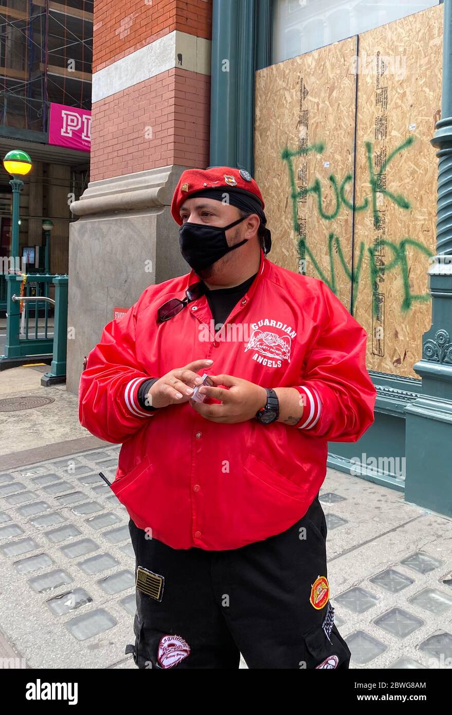 Ne York, NY, USA. 1st June, 2020. Guardian Angles stand guard in SoHo ...