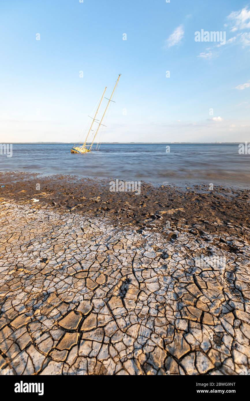 Yacht stranded in Ribble estuary inshore Lytham, Lancs, England, UK ...