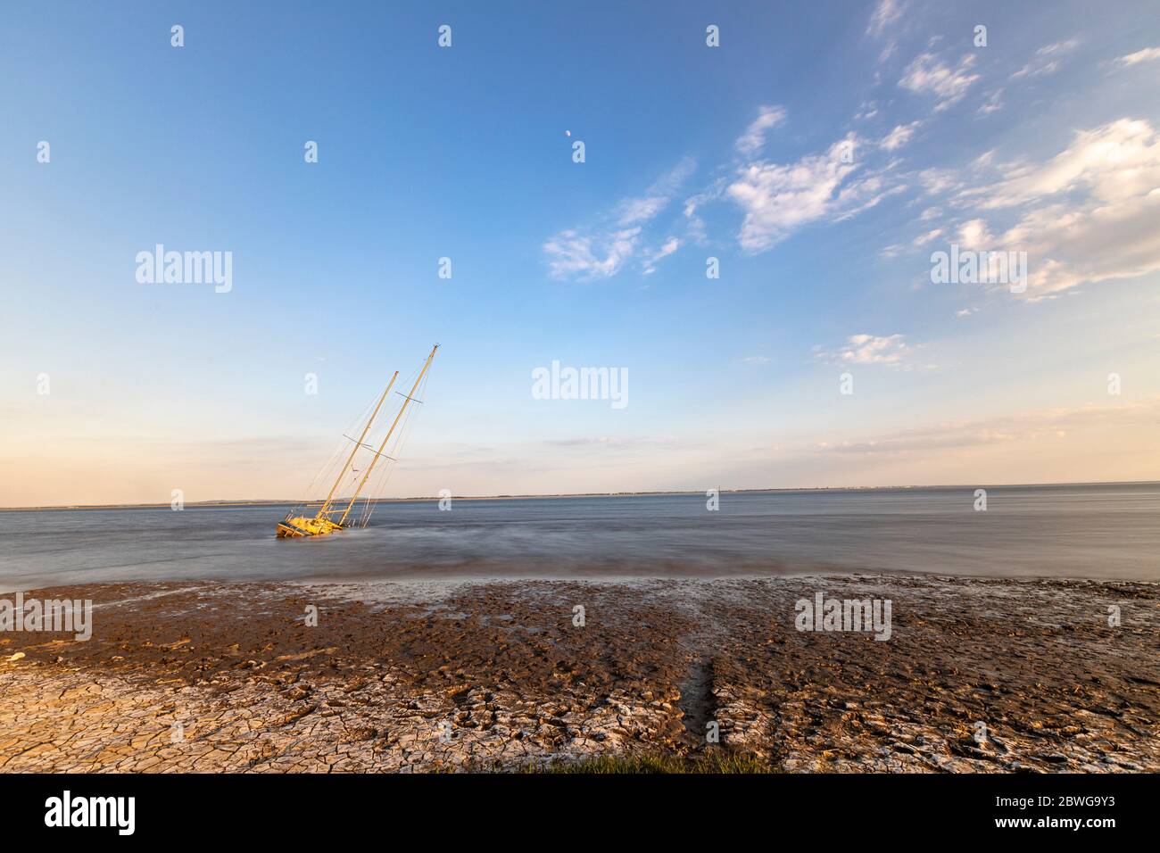 Yacht stranded in Ribble estuary inshore Lytham, Lancs, England, UK ...