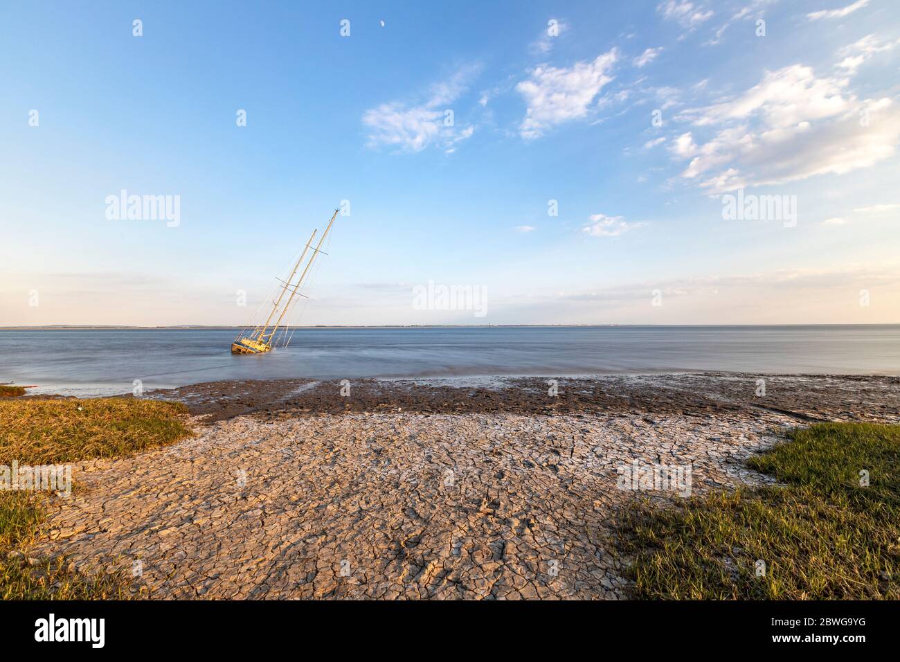 Yacht stranded in Ribble estuary inshore Lytham, Lancs, England, UK ...