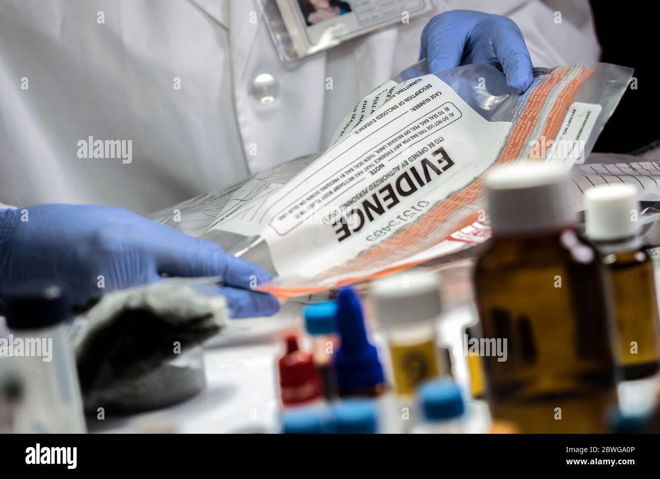 Police specialized taking sample of a bag of evidence in forensic ...