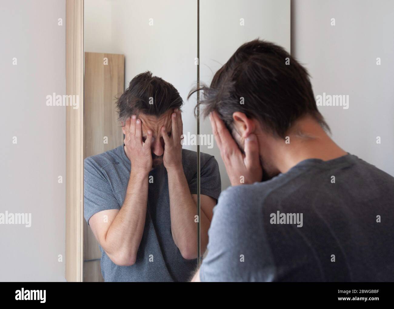 Man depression mirror hi-res stock photography and images - Alamy