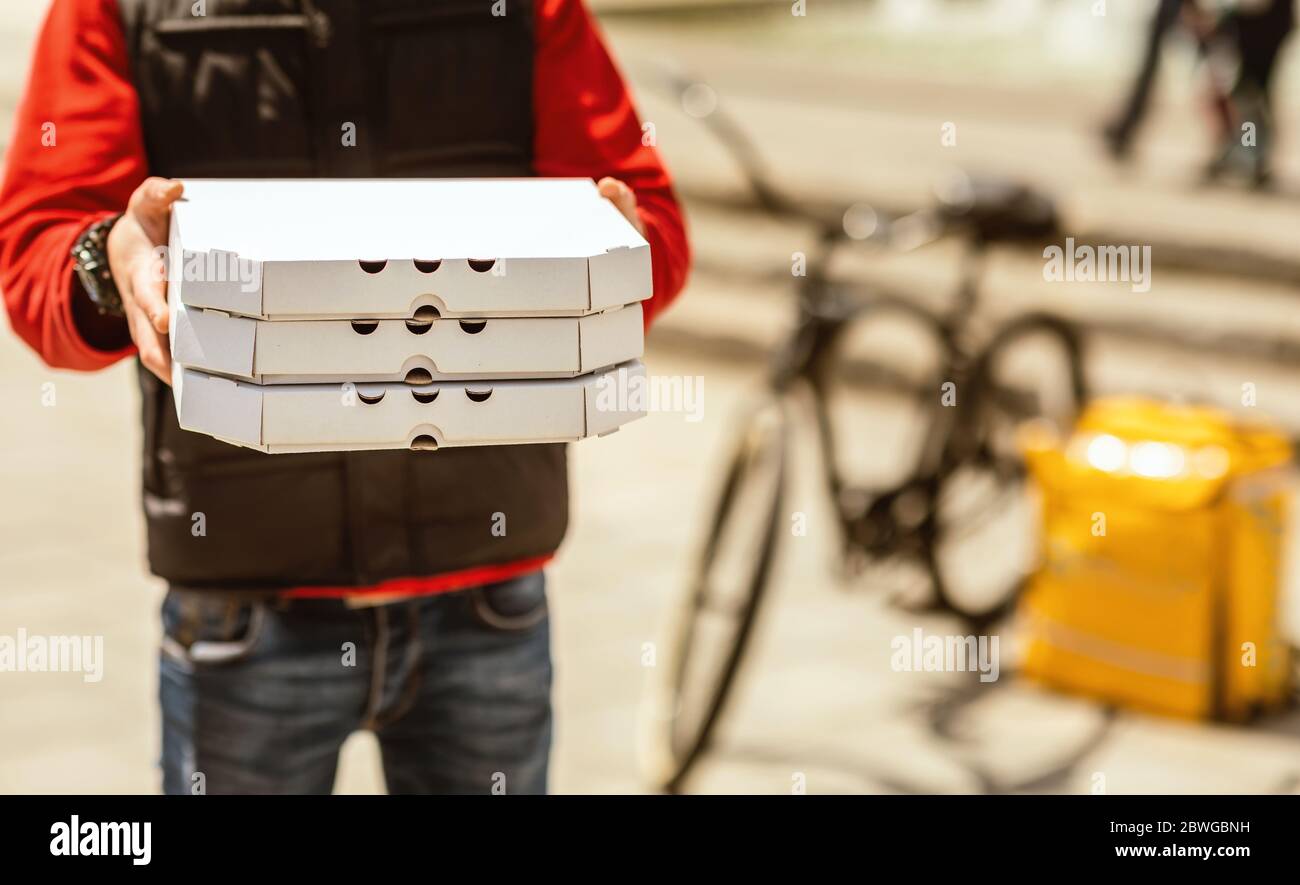 Unrecognizable delivery guy yellow hi-res stock photography and images ...