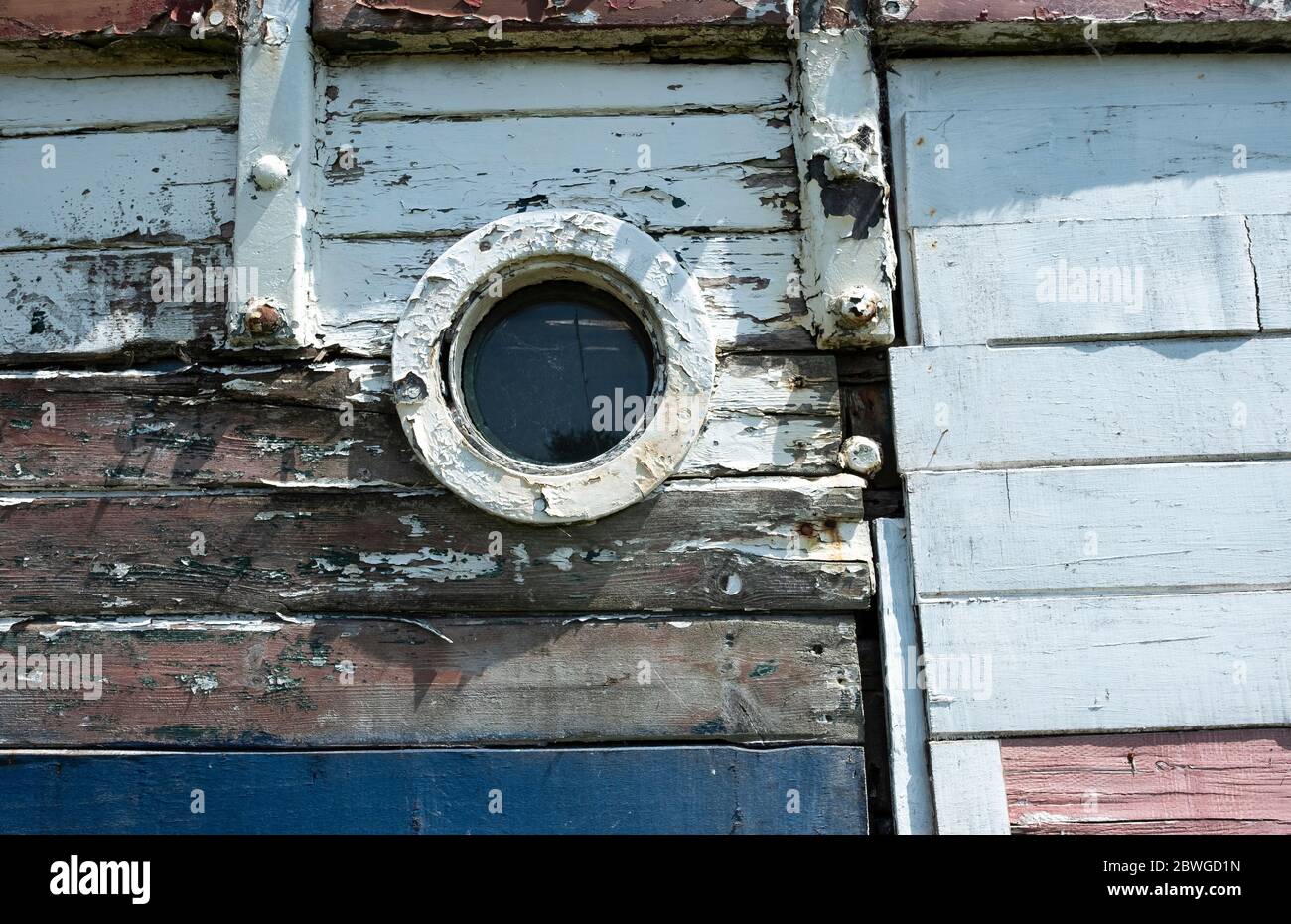 Small round porthole on an old ship Stock Photo - Alamy