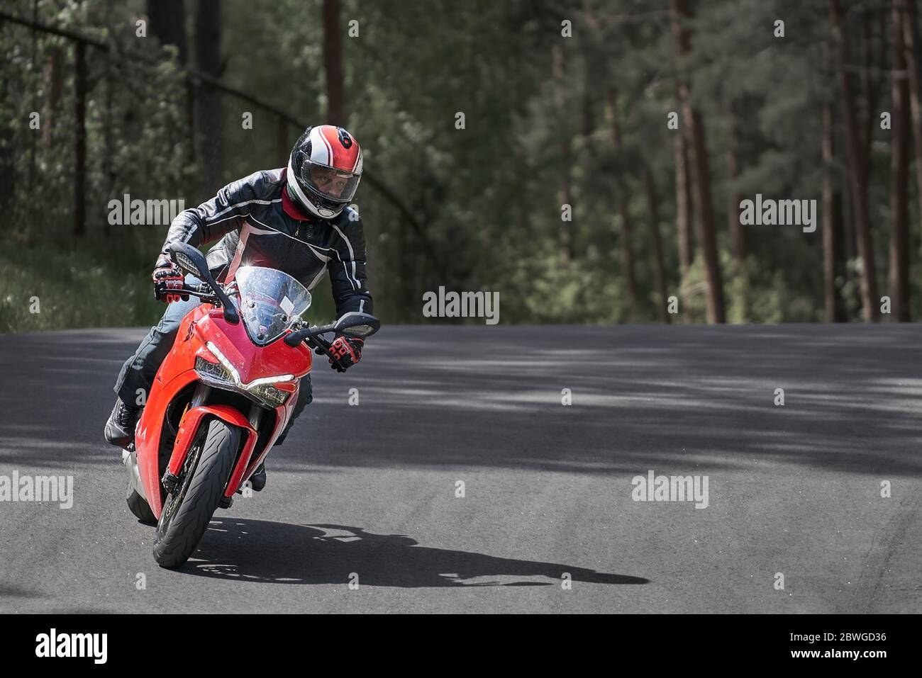 motorcycles standing in the row on asphalt closeup Stock Photo - Alamy