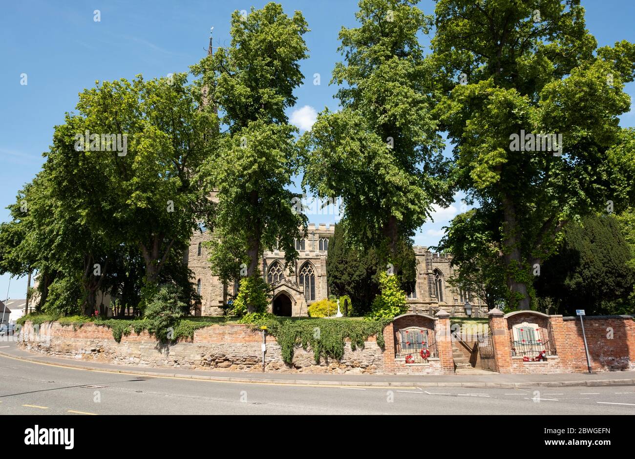 Church yard hidden by trees Stock Photo - Alamy