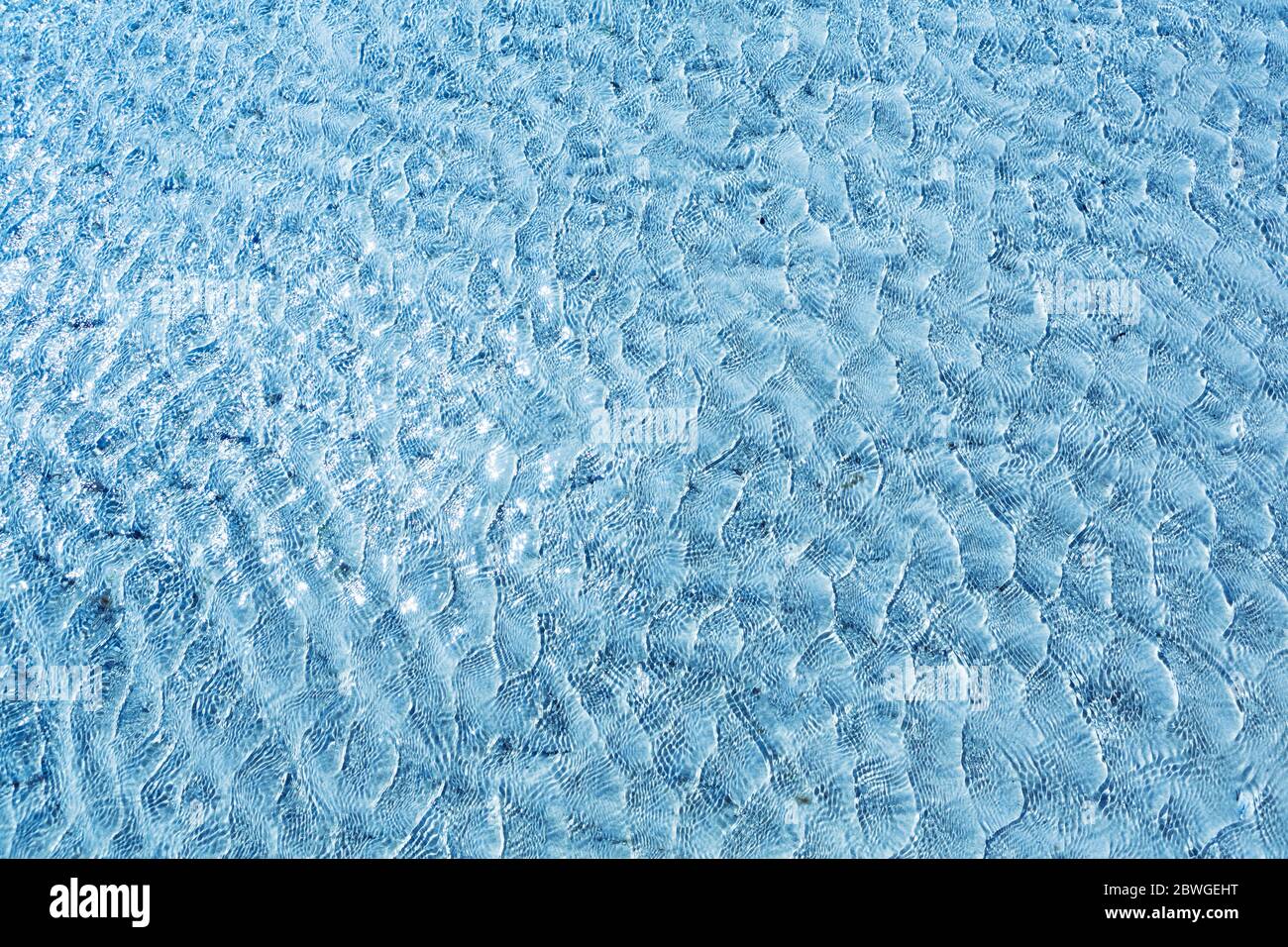 Blue water in swimming pool topview texture. Water with small waves and ...