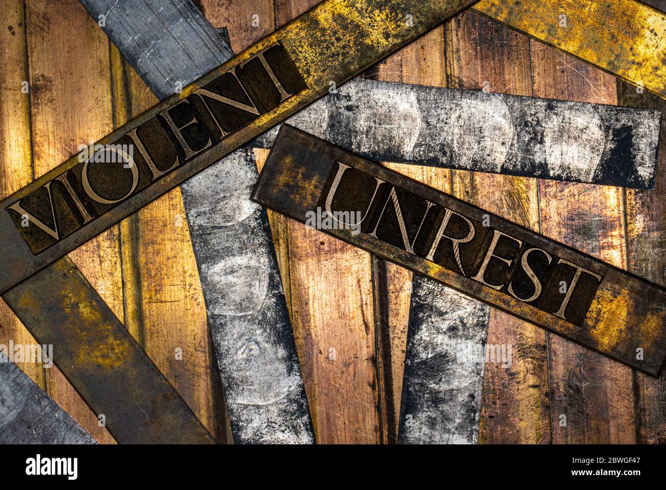 Photo of real authentic typeset letters forming Violent Unrest text on ...