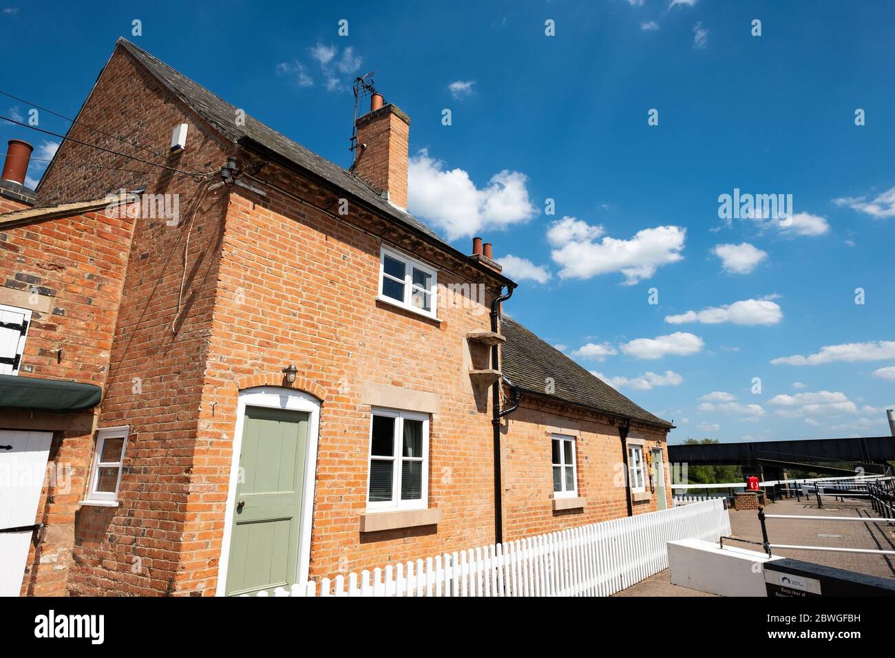 Restored canal lock building Stock Photo - Alamy