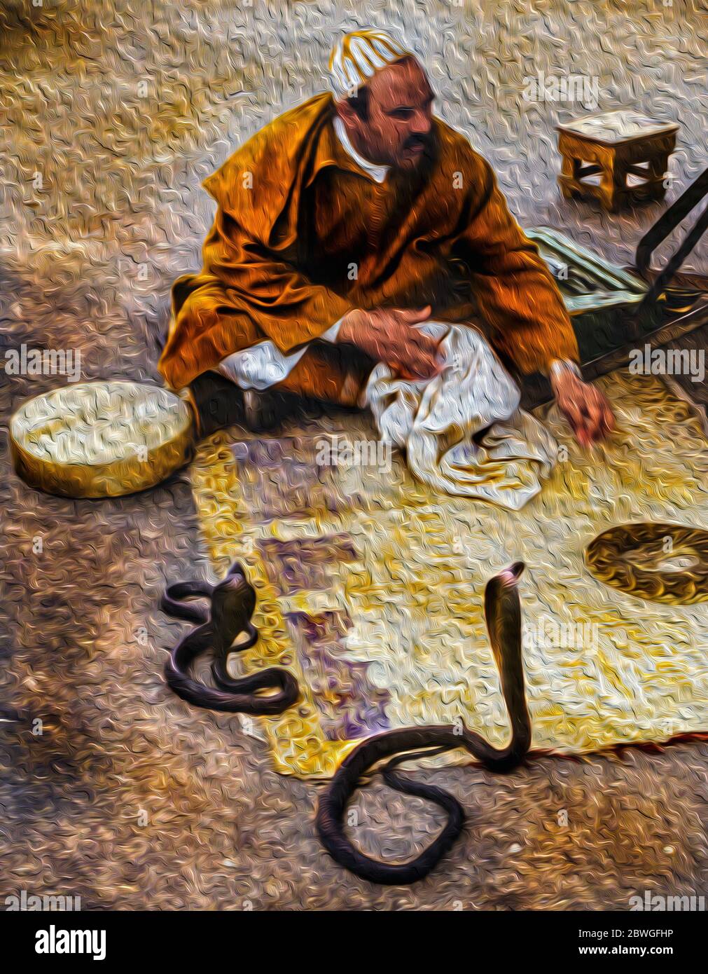 Snake-charmer in typical clothes dangerously near poisonous snakes in ...