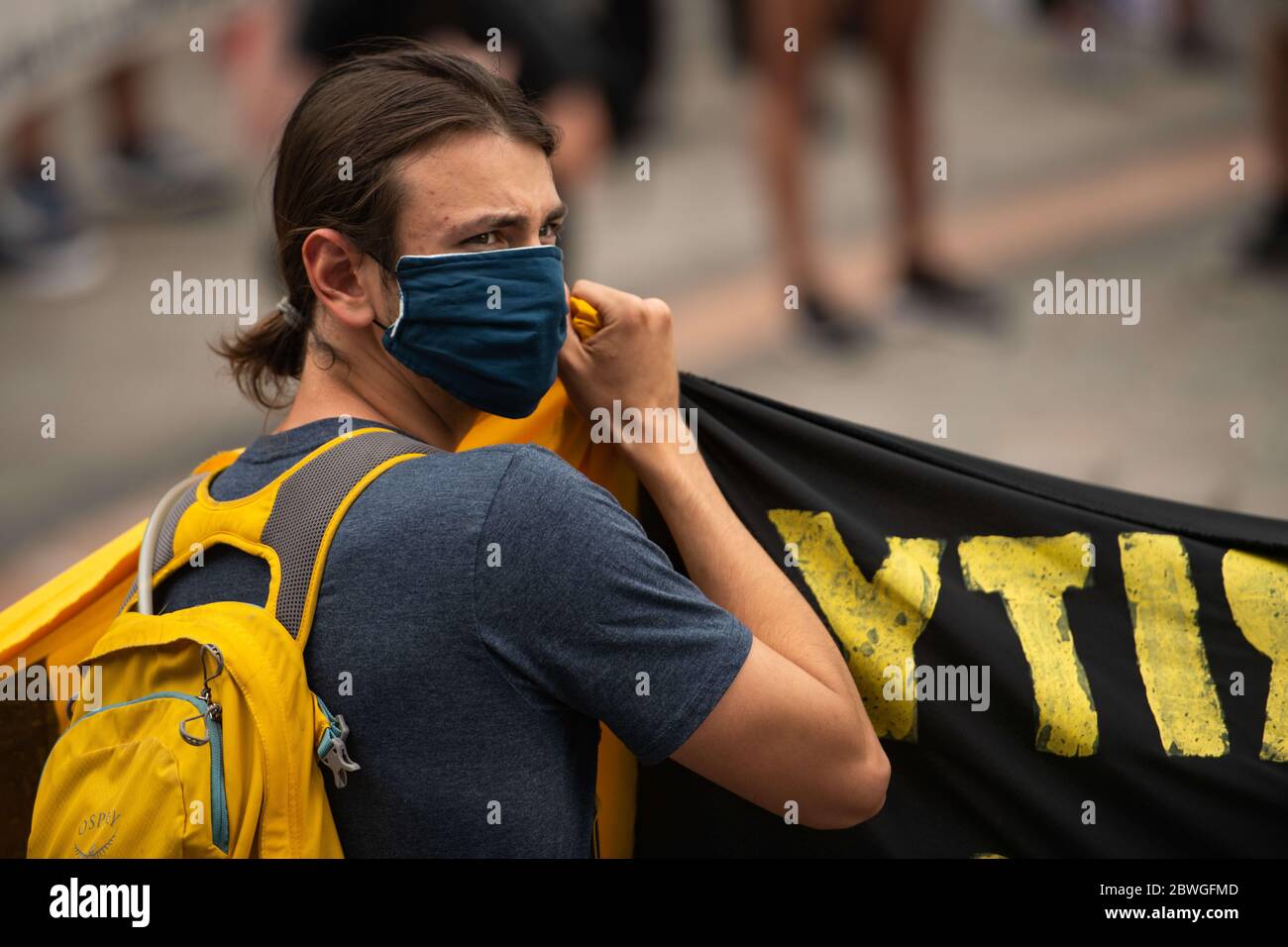 Pushing through crowd hi-res stock photography and images - Alamy