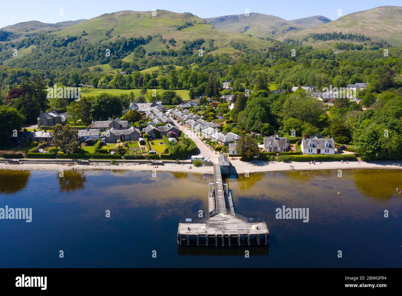 Aerial view of popular tourist village of Luss beside Loch Lomond in ...