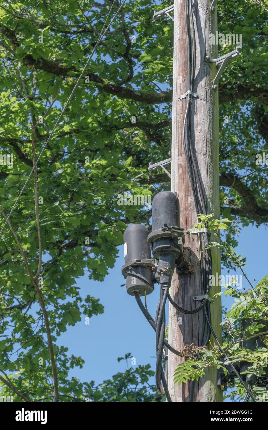 Rural BT utility pole with various fibre optic broadband installations ...