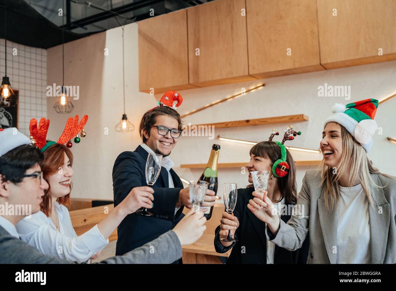 Happy colleagues in office celebrate special event Stock Photo - Alamy