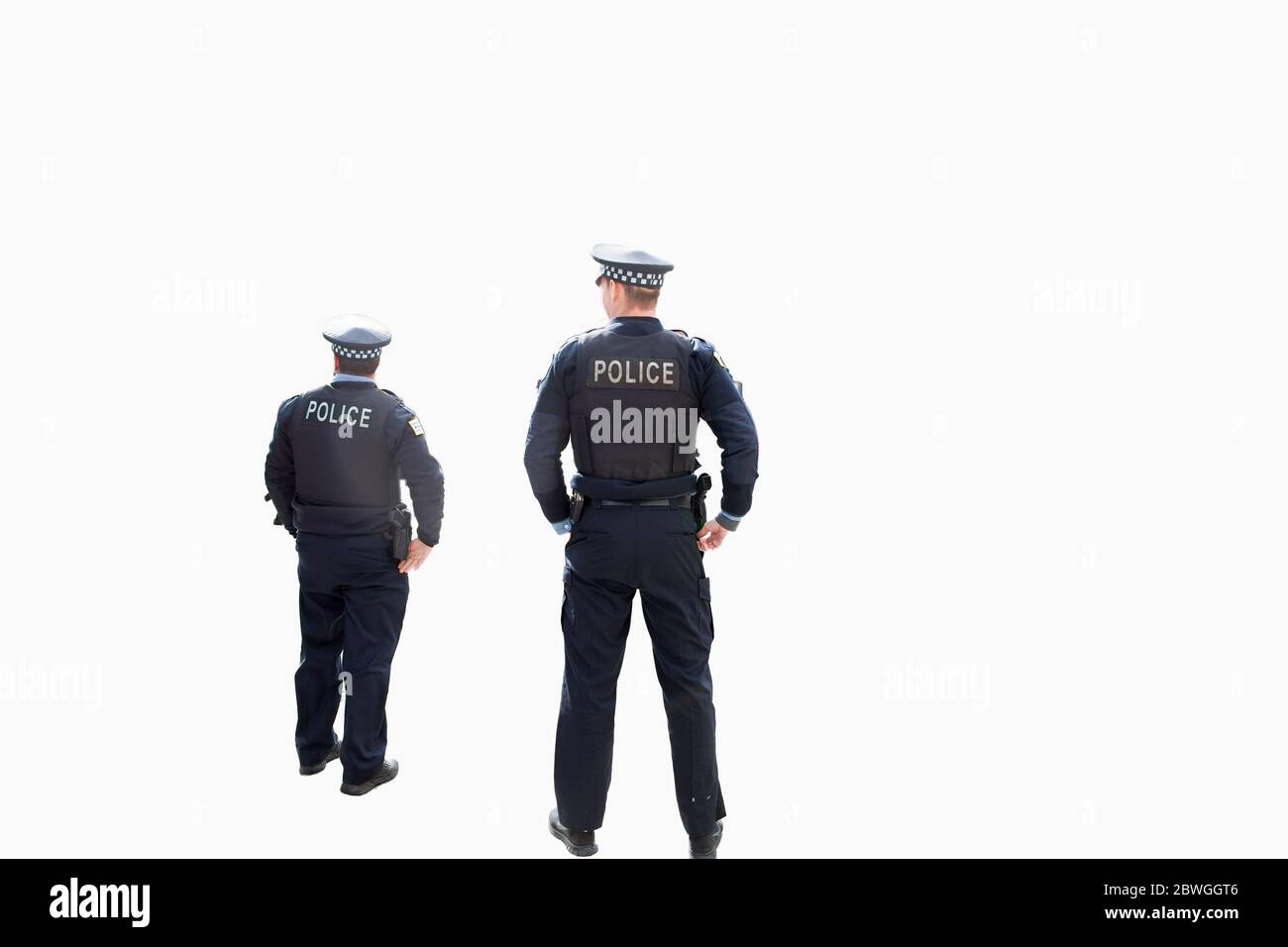 View Of Two Male Police Officers From The Rear On An Isolated White view-of-two-male-police-officers-from-the-rear-on-an-isolated-white