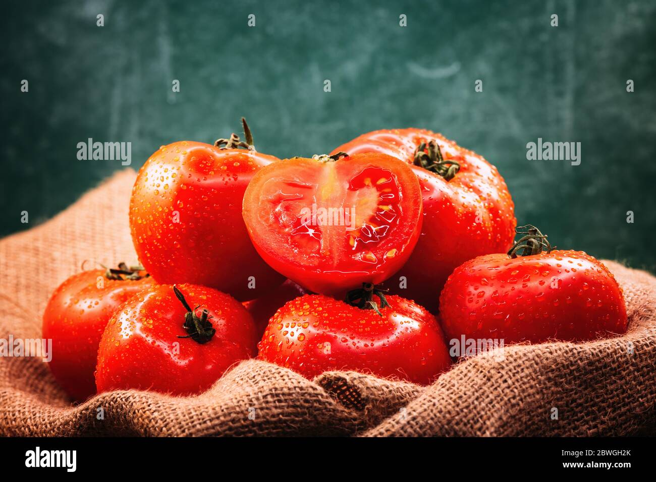 Pile of fresh ripe organic tomato sprayed with water Stock Photo - Alamy