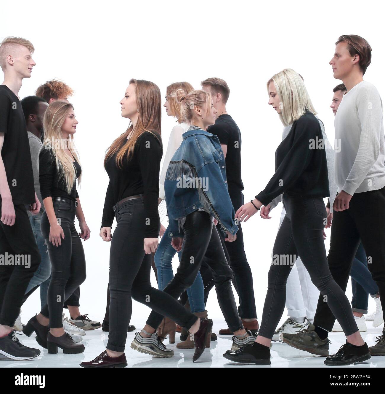 casual young people walking in different directions Stock Photo - Alamy