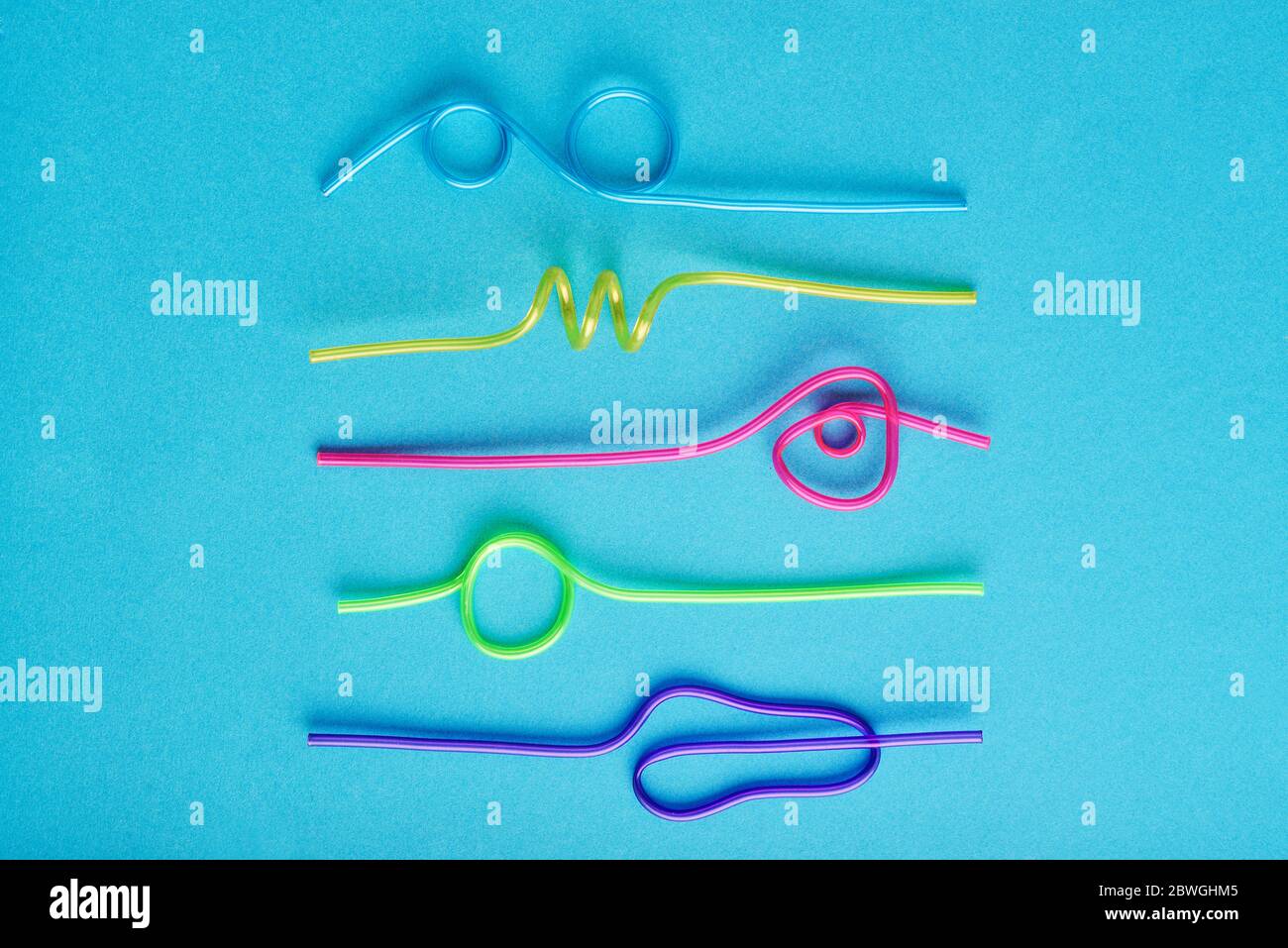 Multi-colored semi-transparent in many shapes straw. Drinking straws in ...