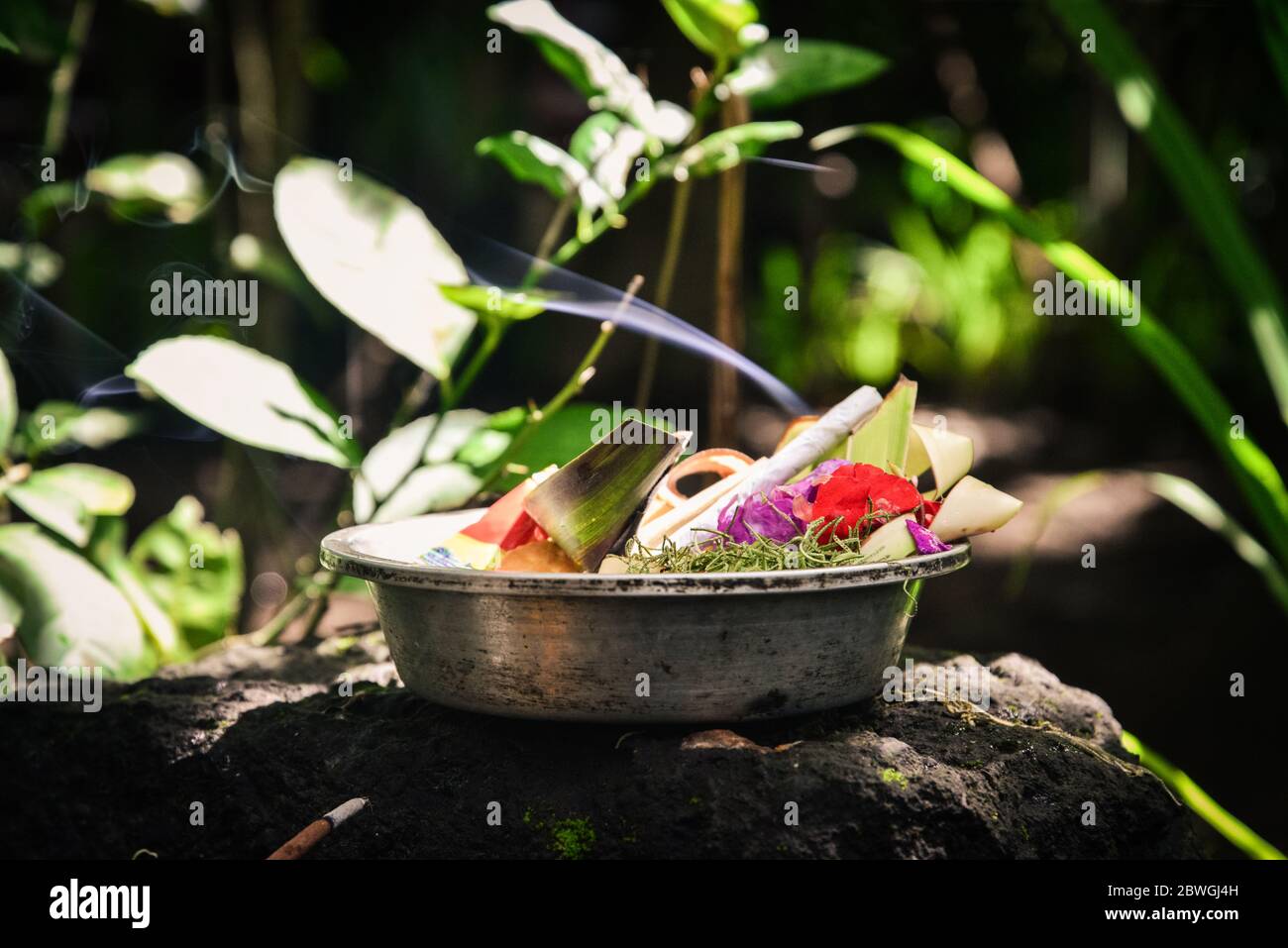 Traditional balinese offerings to gods in Bali with flowers and ...