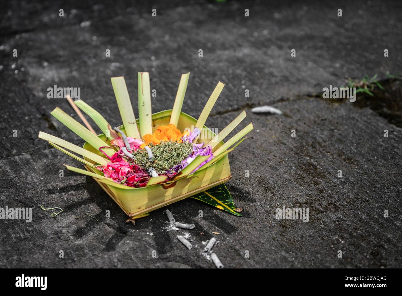 Traditional balinese offerings to gods in Bali with flowers and ...