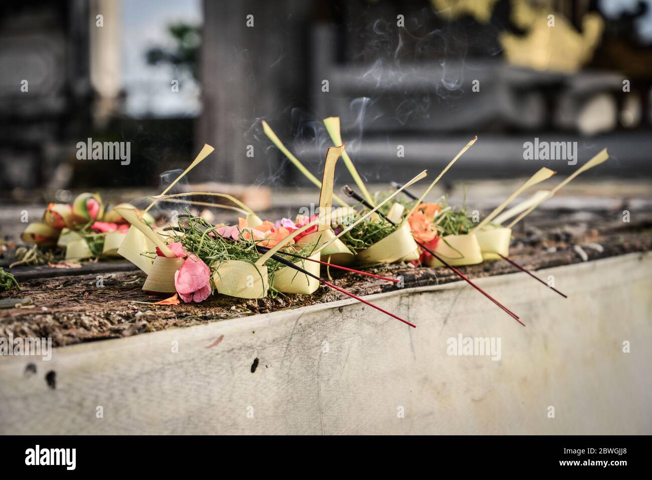 Traditional balinese offerings to gods in Bali with flowers and ...