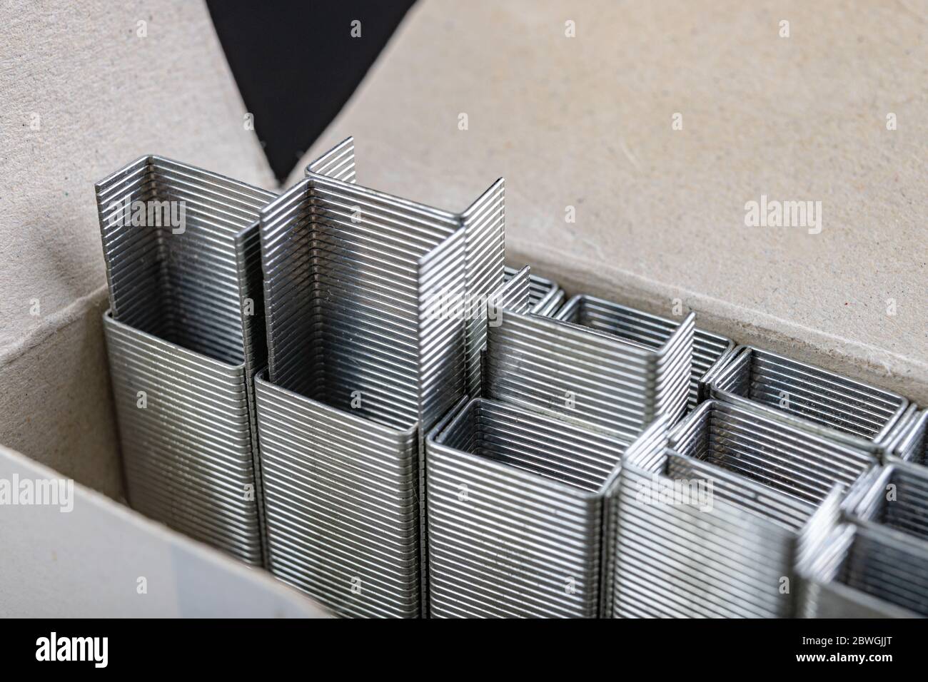 Staples for the office stapler in a cardboard container. Accessories ...