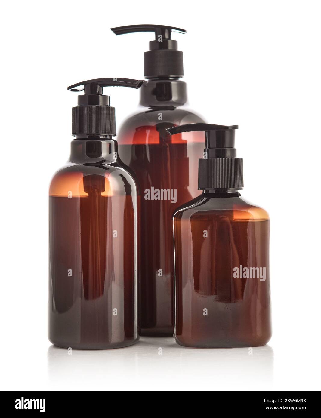 Plastic brown bottles with dispenser pumps isolated on white background ...