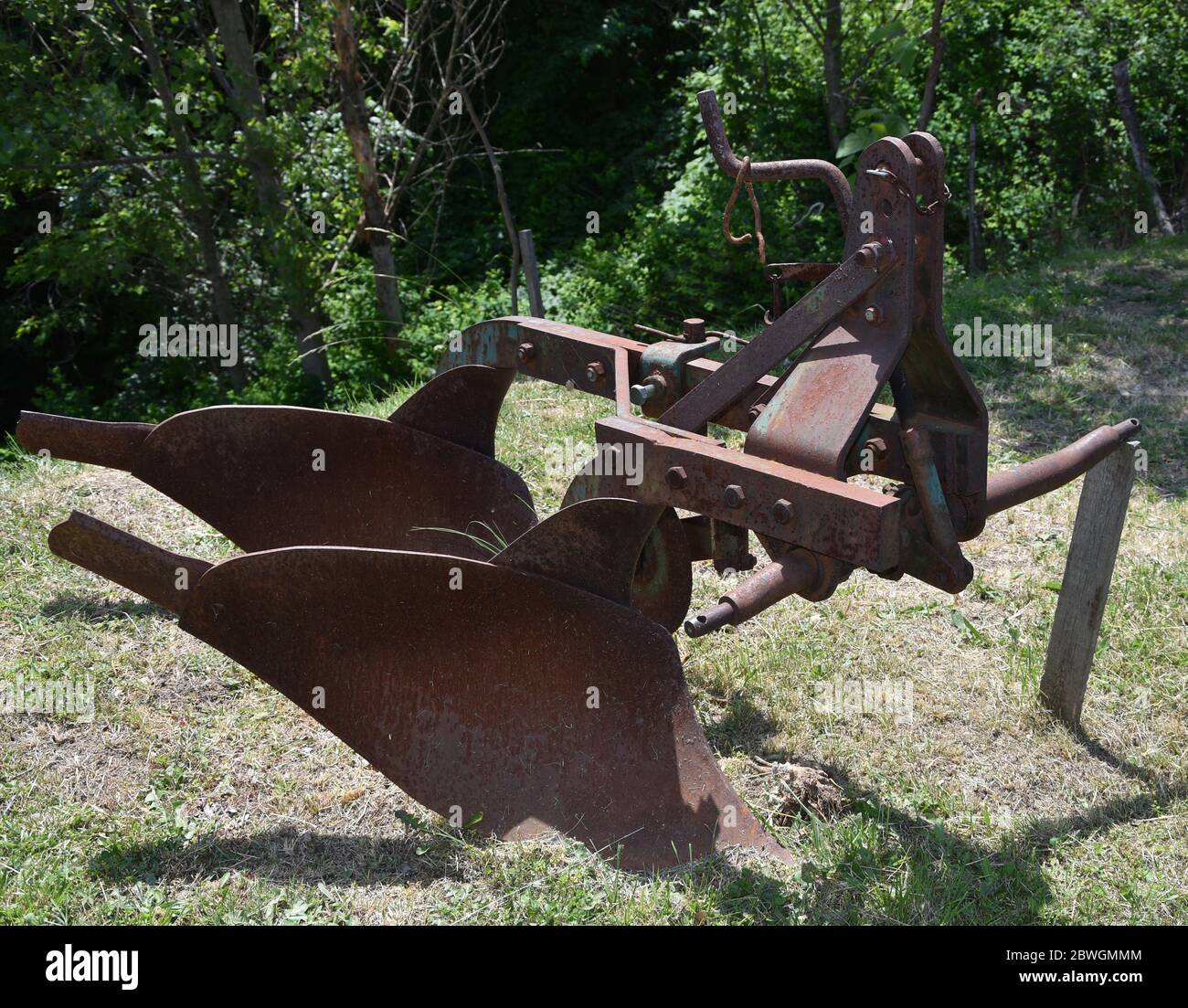 Vintage rusty plow used by farmers with tractors Stock Photo - Alamy