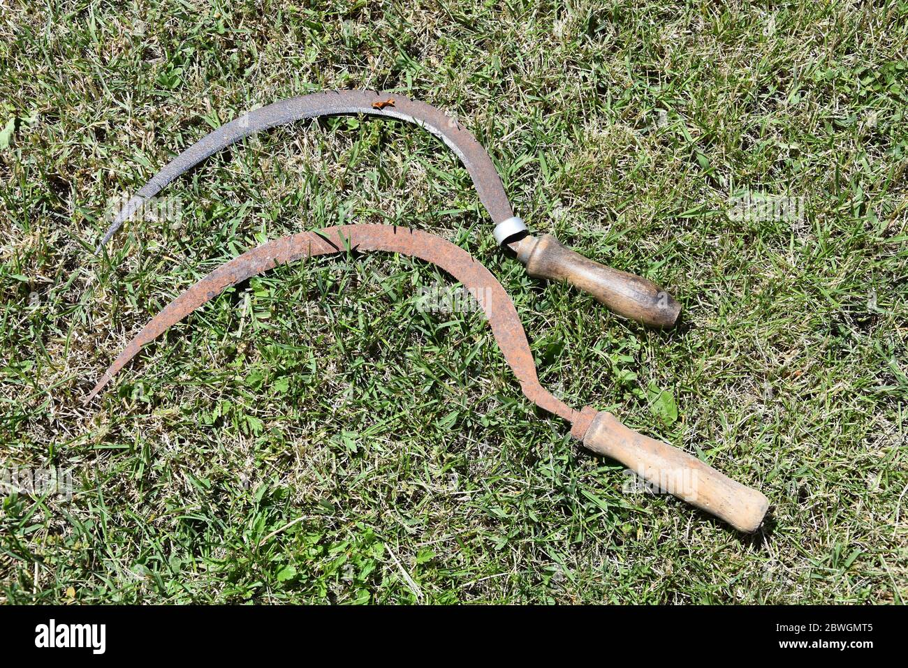 Old rusty sickle used by farmers Stock Photo - Alamy