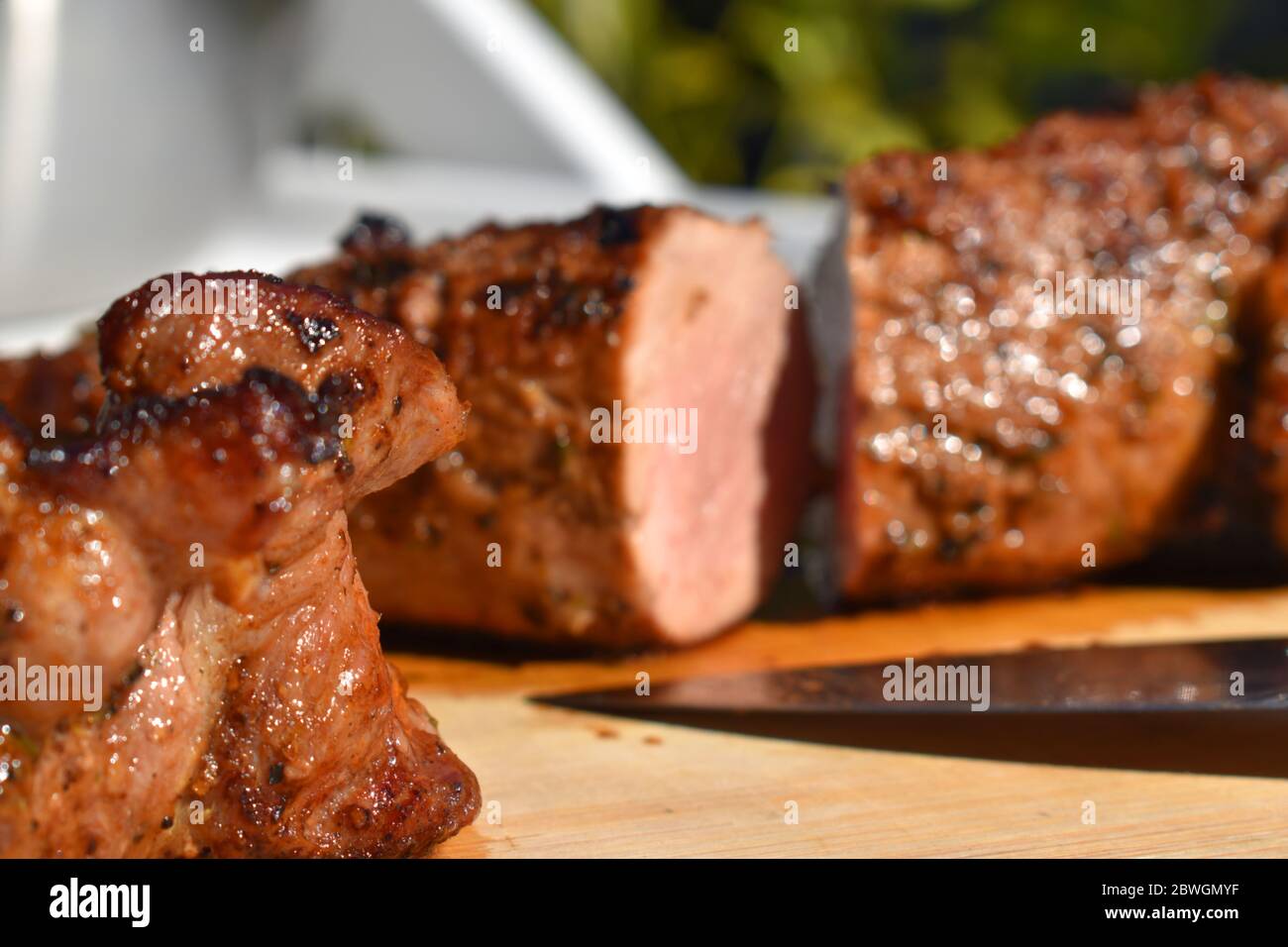 Roasted meat is the glue of friendship Stock Photo - Alamy