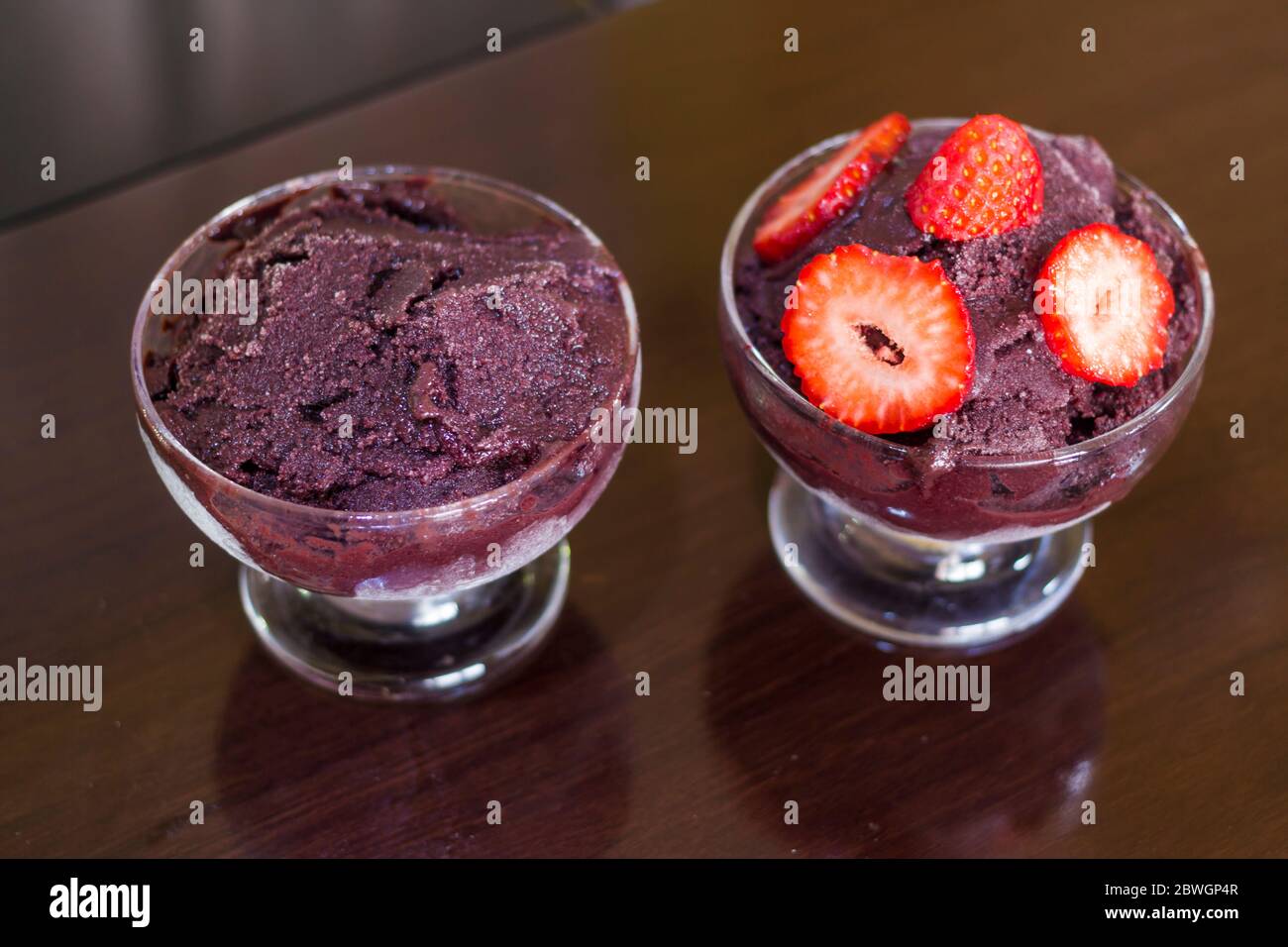 Acai cream topped with strawberry Stock Photo - Alamy