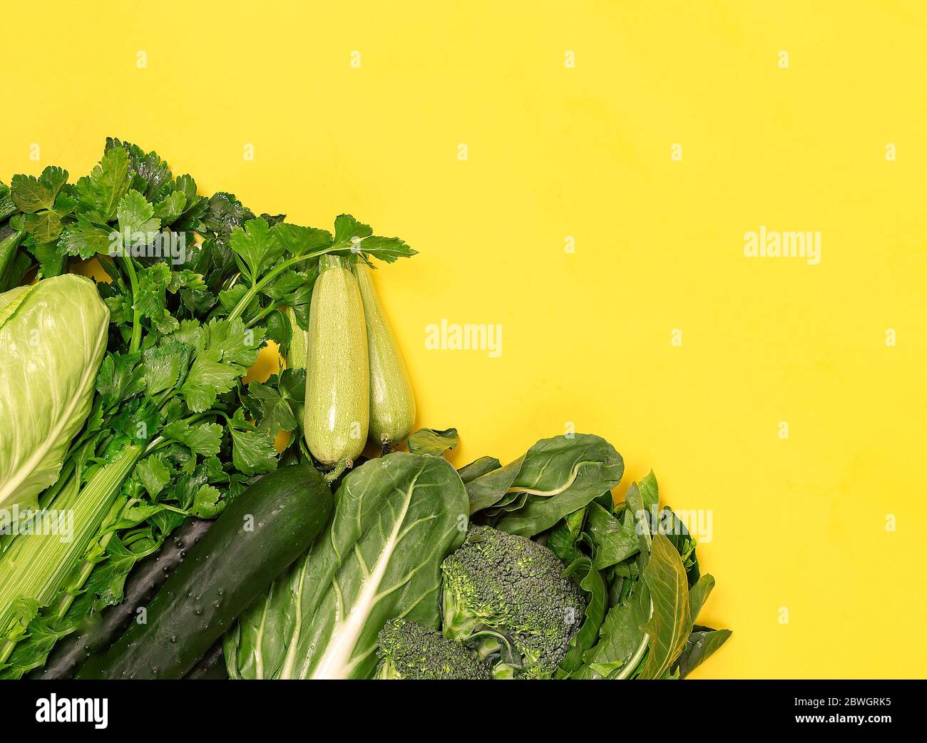 fresh organic vegetables on yellow table from above Stock Photo - Alamy