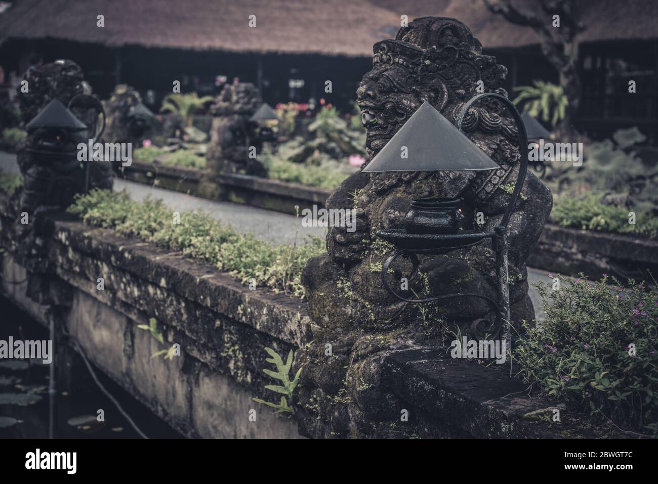 Traditional balinese stone statue near Pura Taman Kemuda Saraswati ...