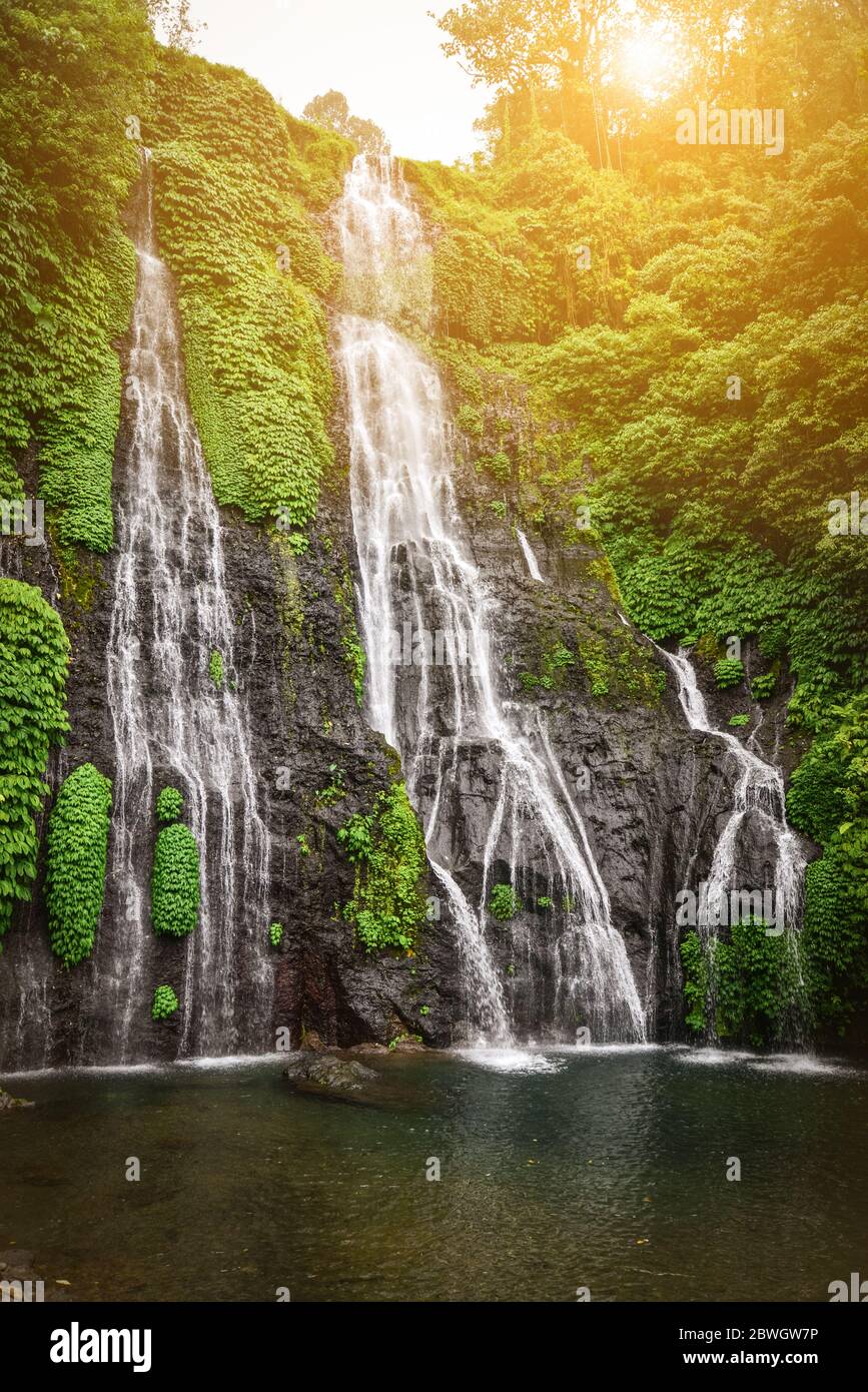 Jungle waterfall cascade in tropical rainforest with rock and turquoise ...