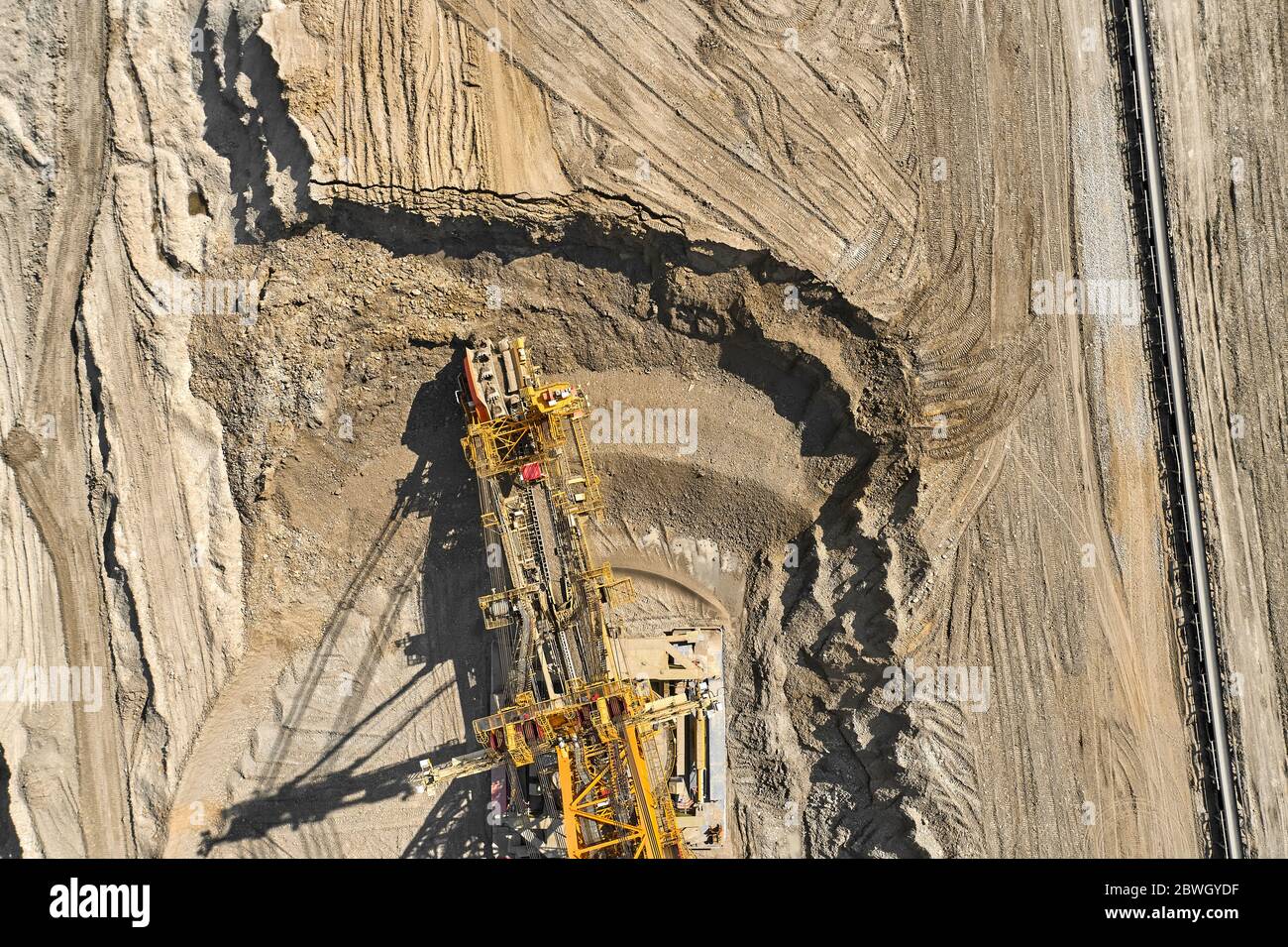 Aerial view of large heavy equipment machine mining natural resource ...