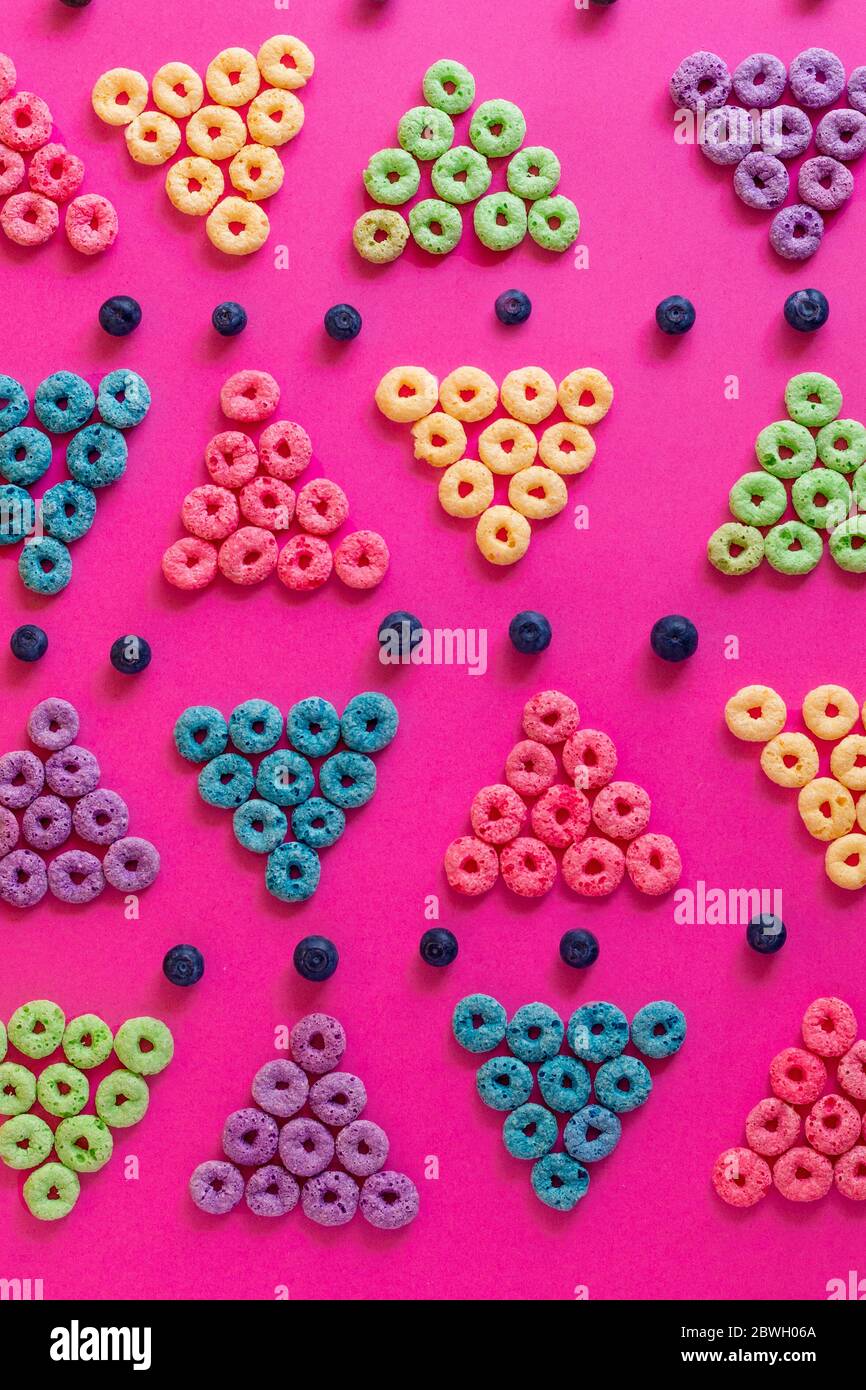 froot loops in the shape of a triangle blue, green, purple, pink ...