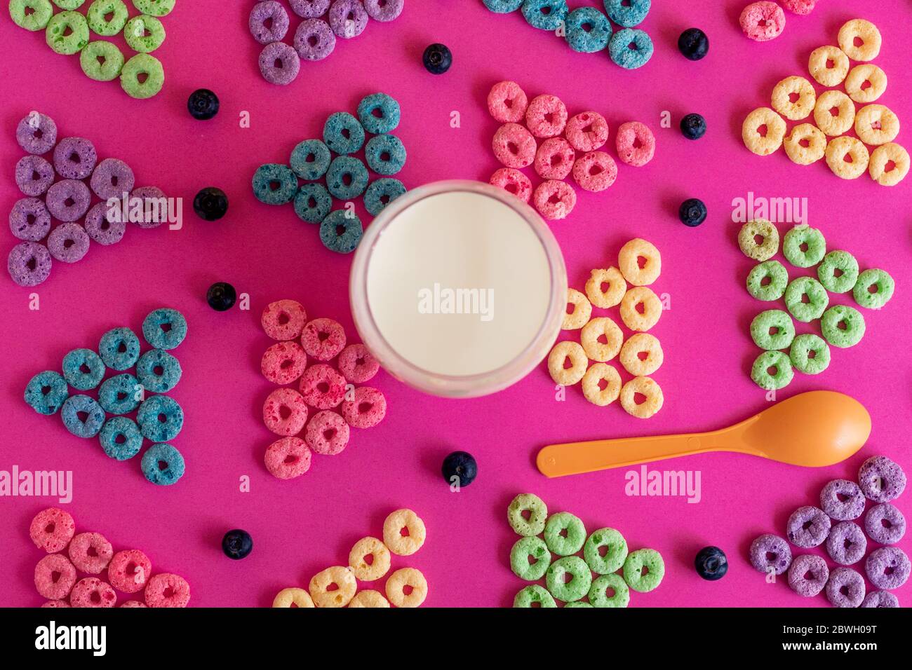 froot loops in the shape of a triangle blue, green, purple, pink ...