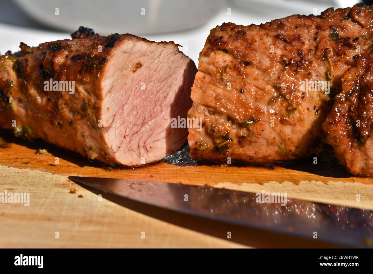 Roasted meat is the glue of friendship Stock Photo - Alamy