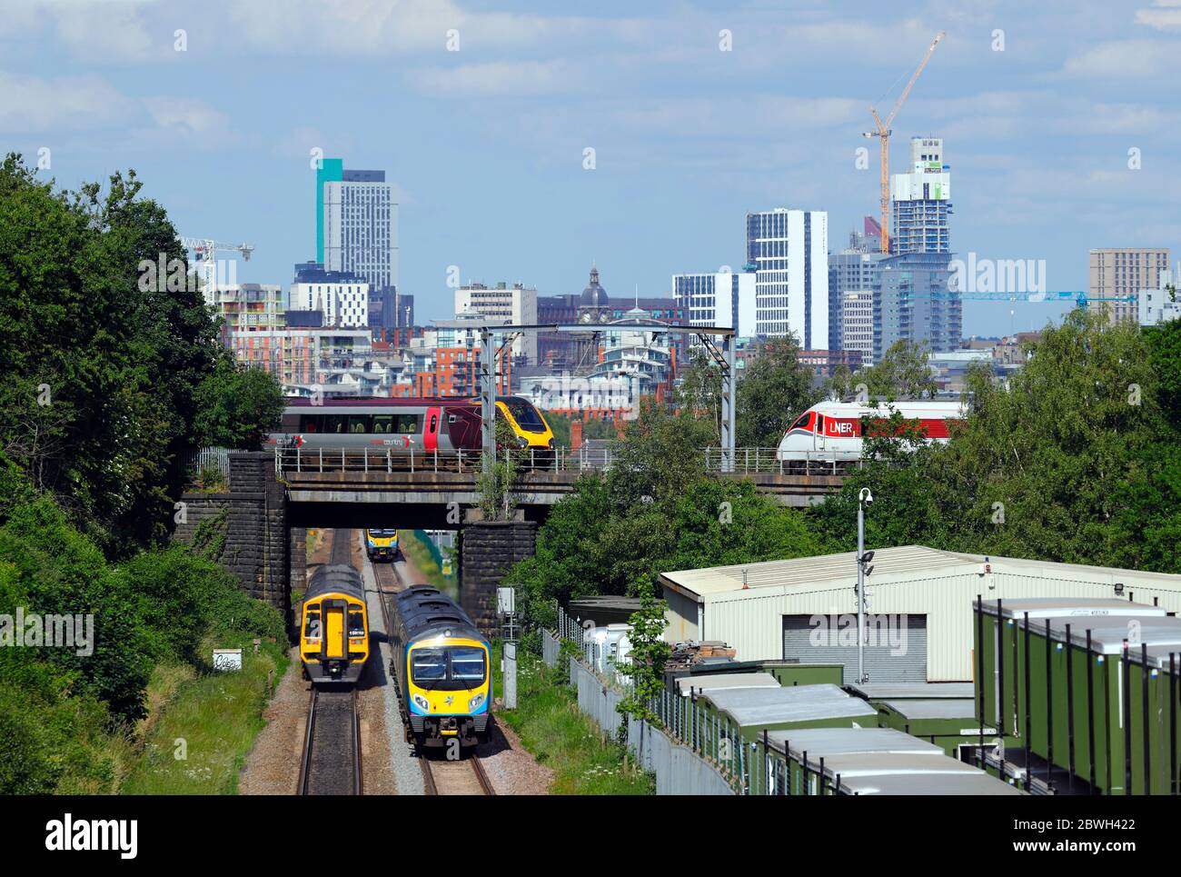 A composite image of trains passing over and under a railway bridge in ...