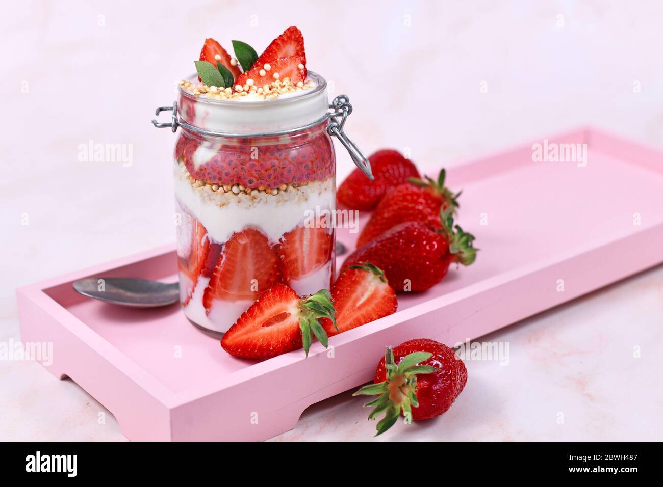 Strawberry fruit dessert with yogurt, healthy chia seeds and puffed ...