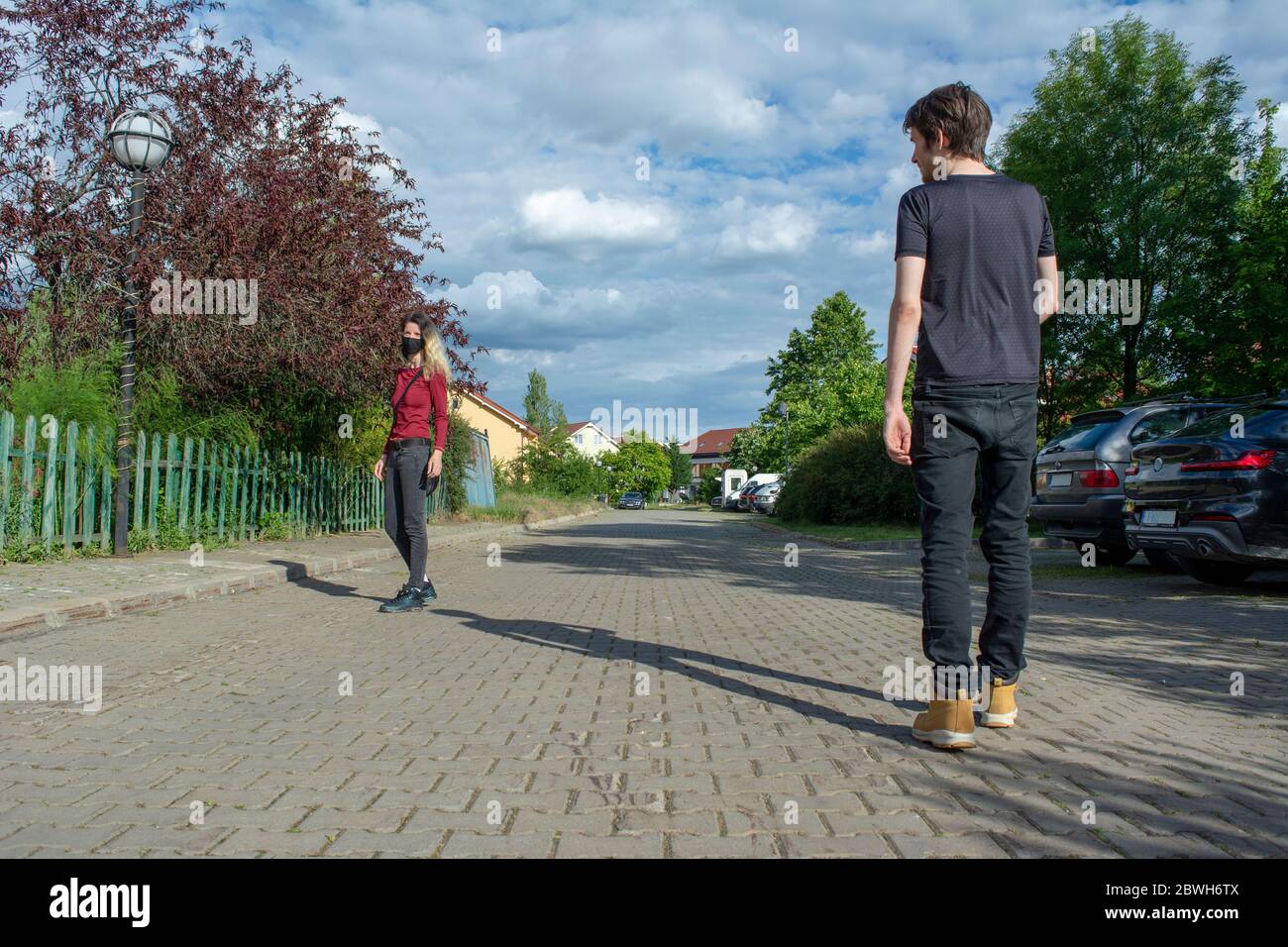 Concept of two people maintaining social distance on the street Stock ...