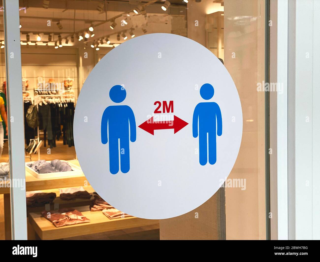 Sticker keep distance on the glass in store in the mall. Concept of ...