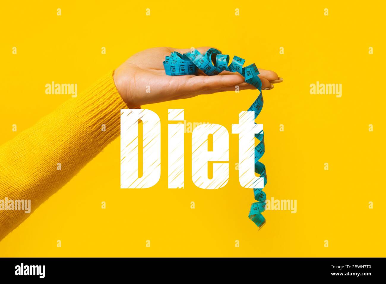 measuring tape on hand over yellow background, diet concept Stock Photo ...