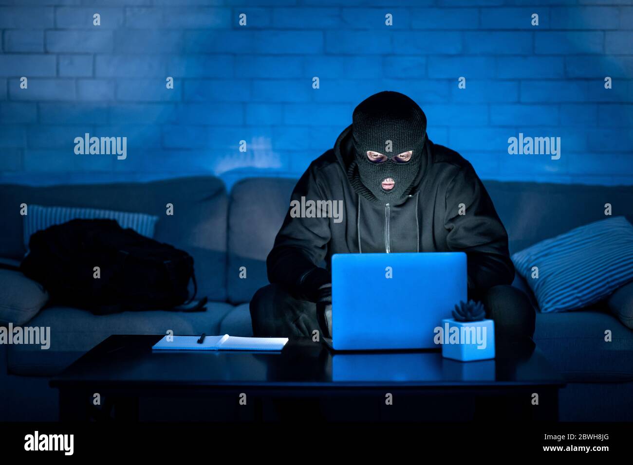 Hacking computer masked data hi-res stock photography and images - Alamy