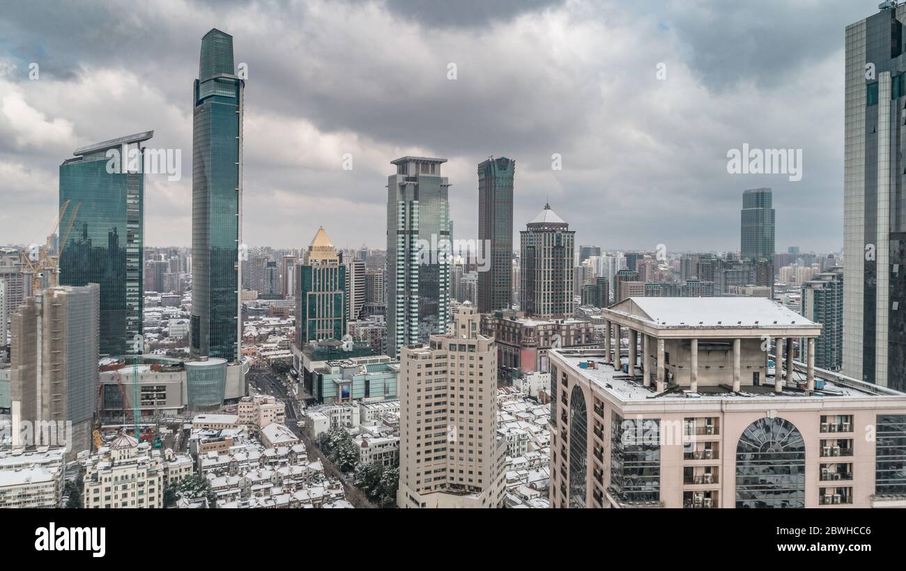 aerial view of Shanghai cityscape and skyscrapers after a snowfall ...