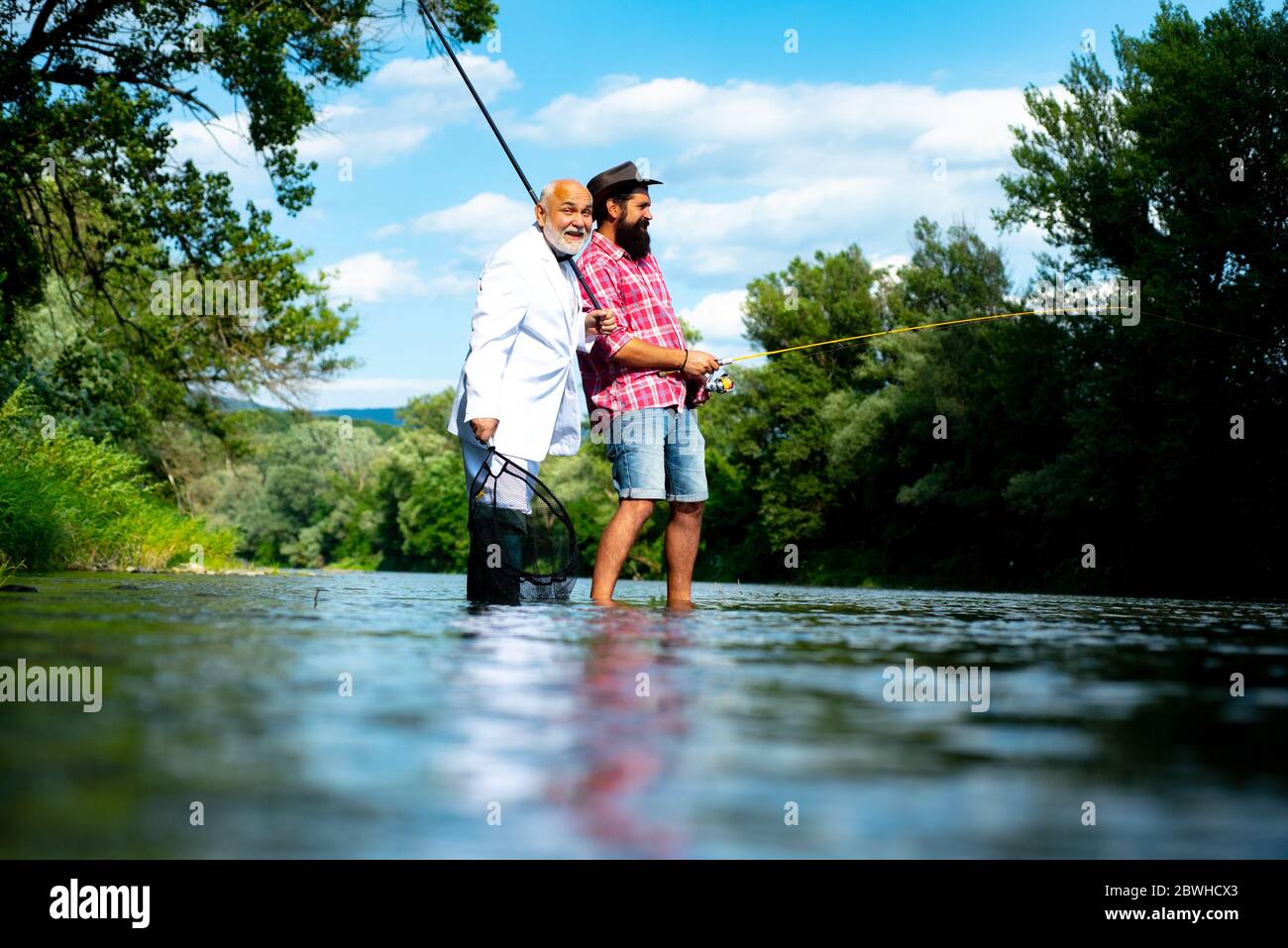 Man bearded fisher. Bearded fisher in water. Catch me if you can. Just ...