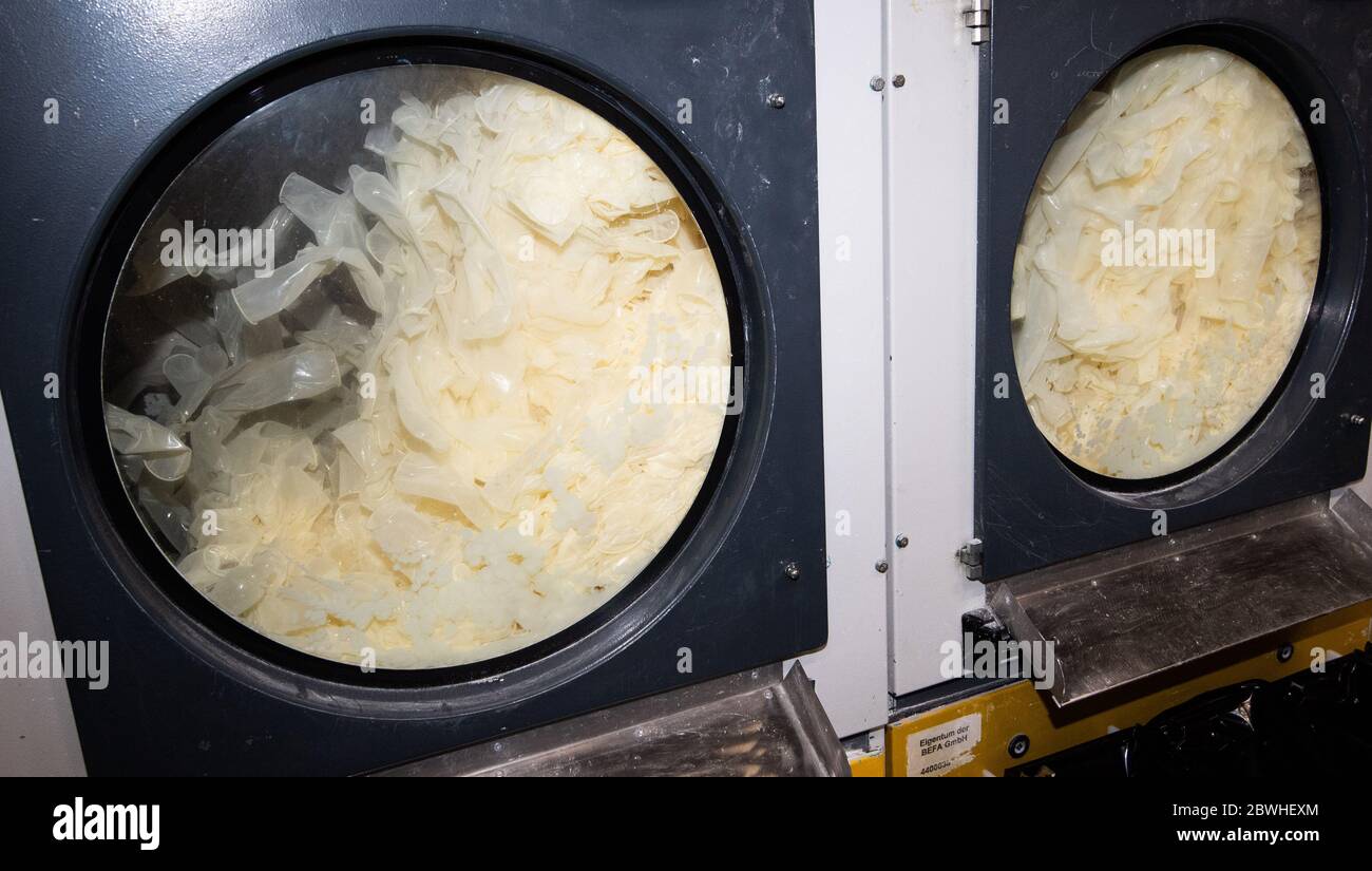 Sarstedt, Germany. 20th May, 2020. Freshly formed condoms are dried ...
