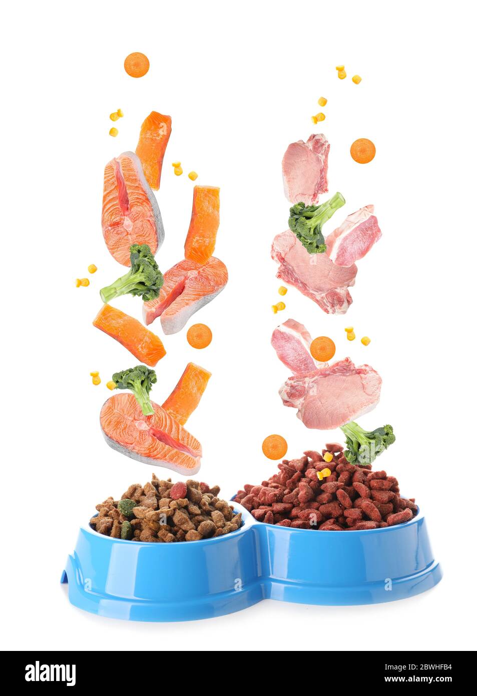 Different pet food falling into bowls against white background Stock ...