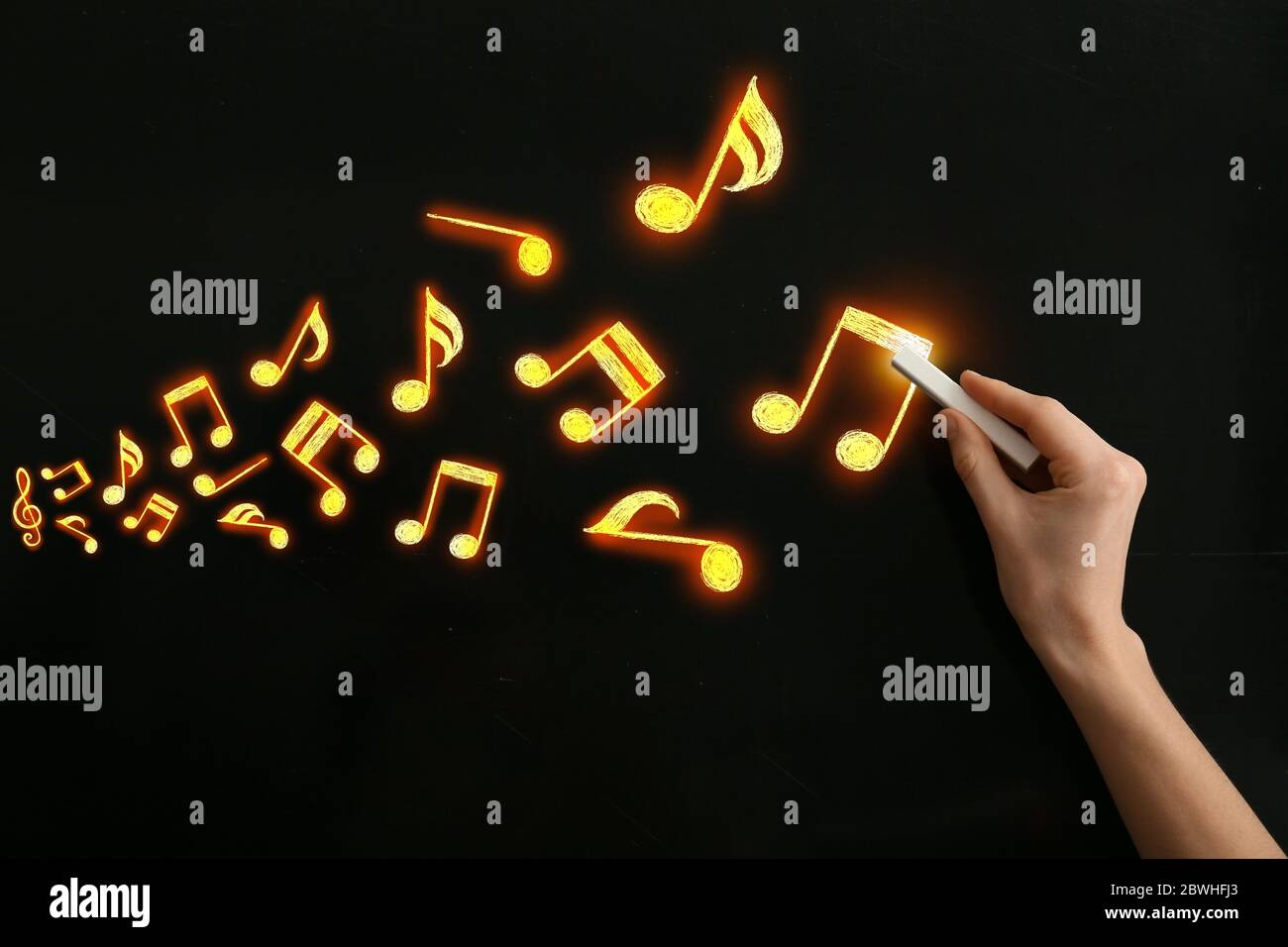 Hand writing note signs on dark background Stock Photo - Alamy